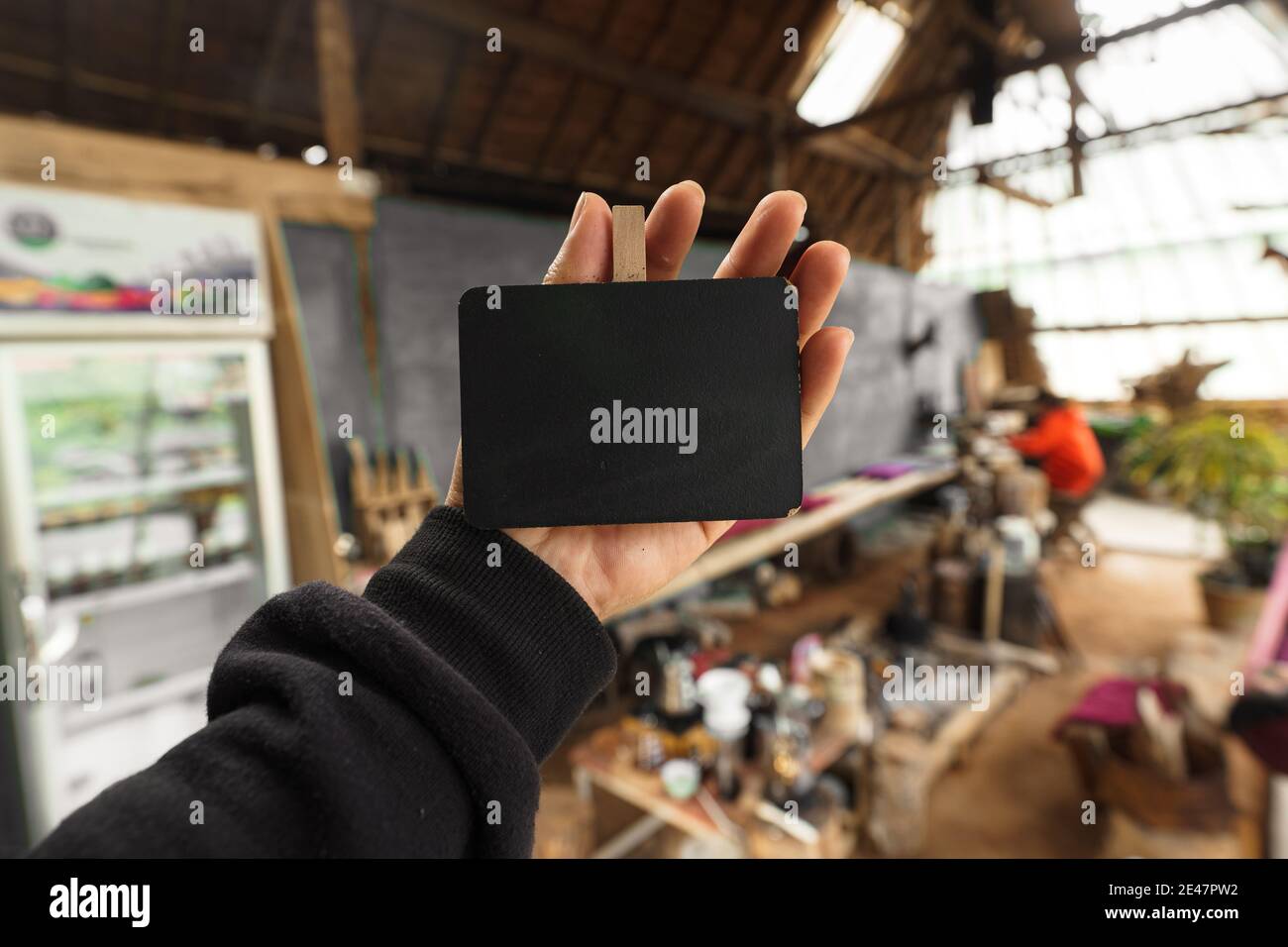 A small blackboard in a cafe On the hand Stock Photo - Alamy