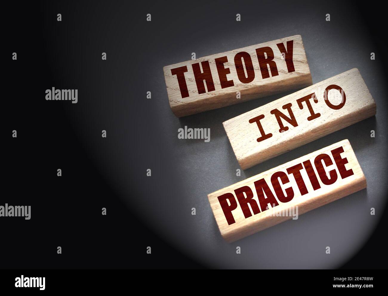 Theory into practice words written on wooden blocks. Education or ...