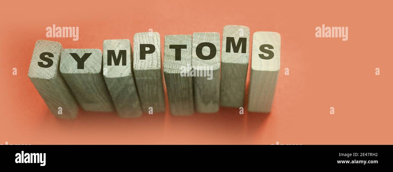 Symptoms word from wooden blocks with letters, viral diseases ...
