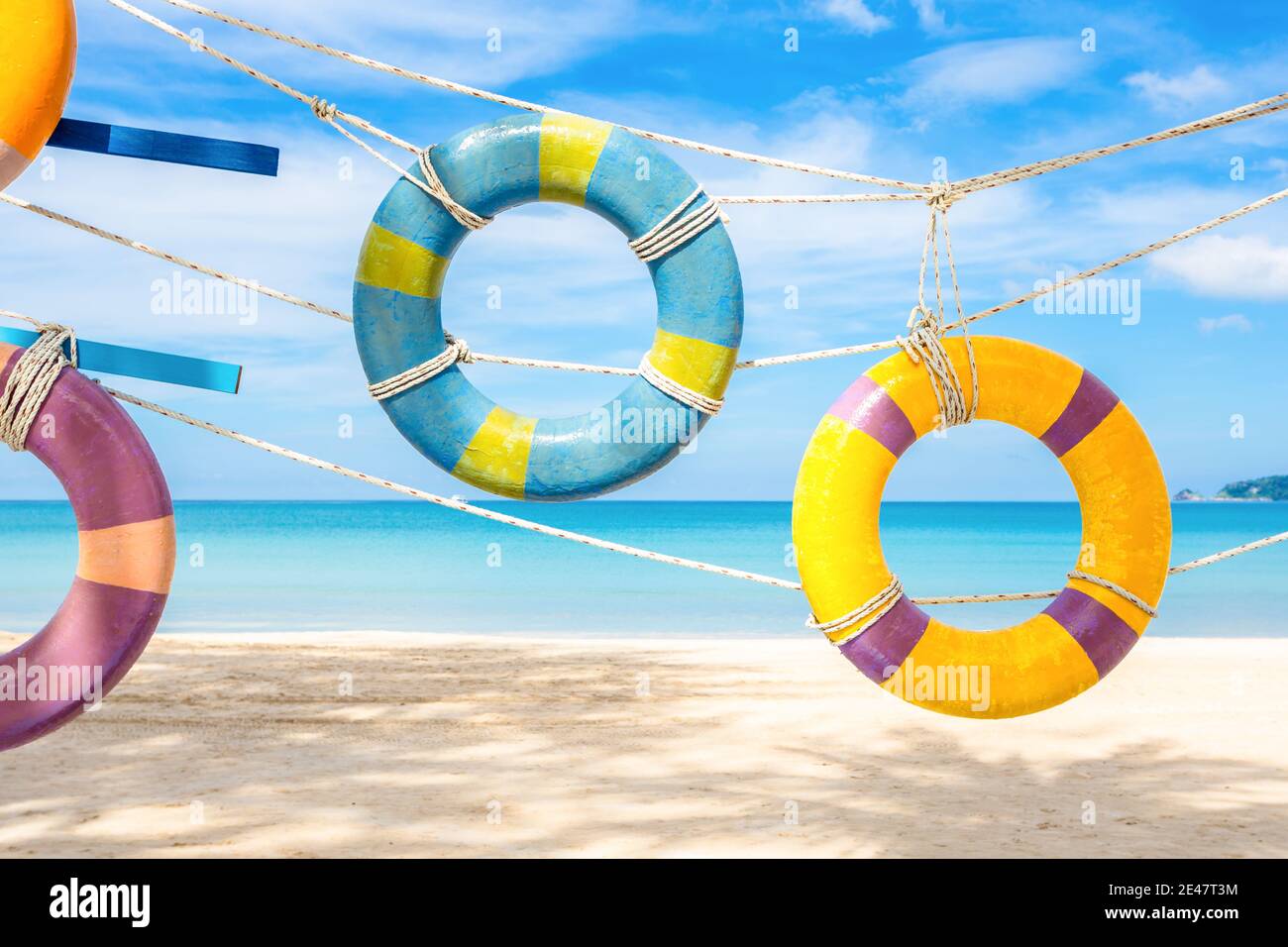 Artificial swim ring rubber on the beach with blue sky in summer Stock ...