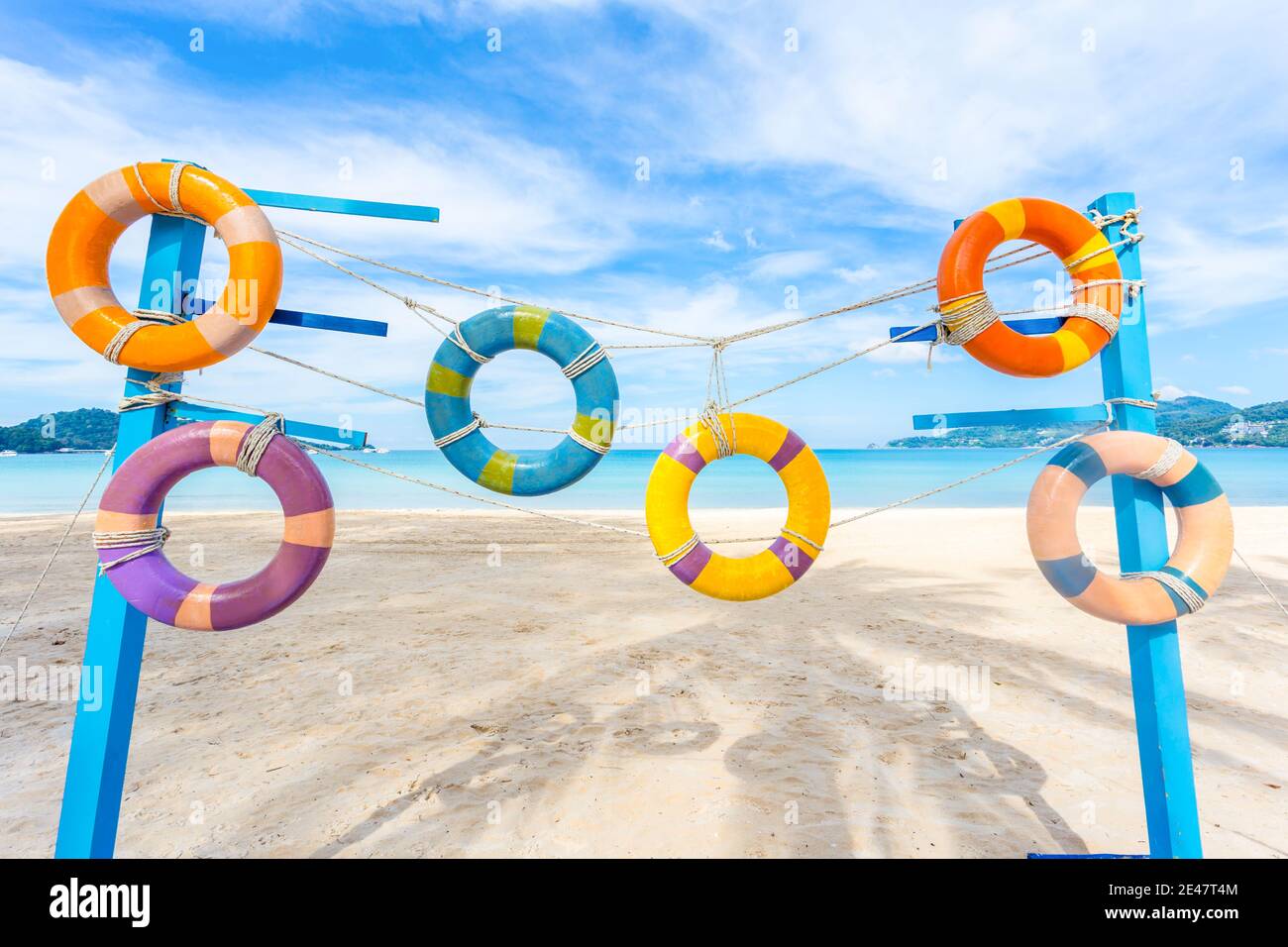 Artificial swim ring rubber on the beach with blue sky in summer Stock ...