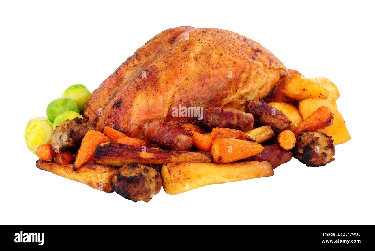 Whole golden roasted turkey crown meat with mixed vegetables and pigs ...