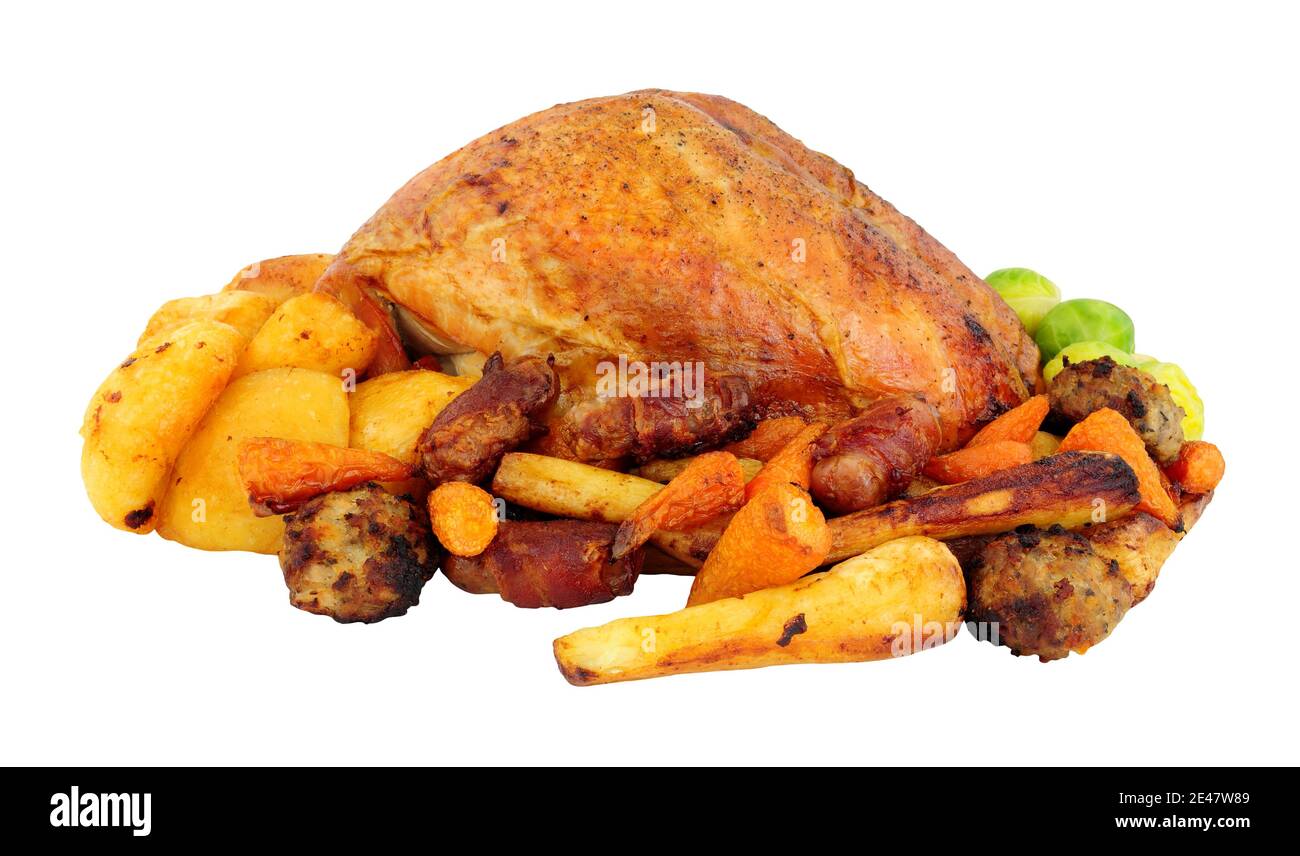 Whole golden roasted turkey crown meat with mixed vegetables and pigs ...