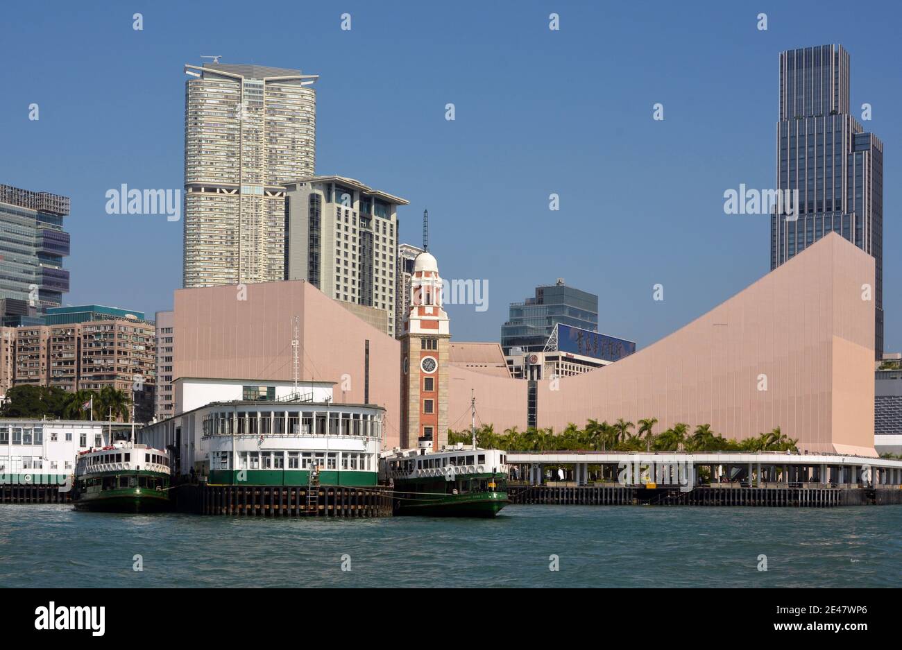 Star ferries on the Kowloon public pier. The famous boats take ...