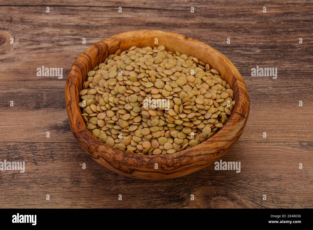 Vegan cuisine - Dry lentil heap isolated Stock Photo - Alamy