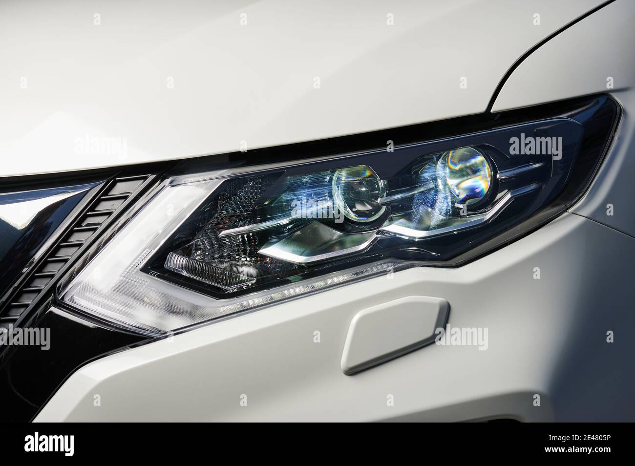 Shiny modern car headlights with lamp on close up view Stock Photo - Alamy