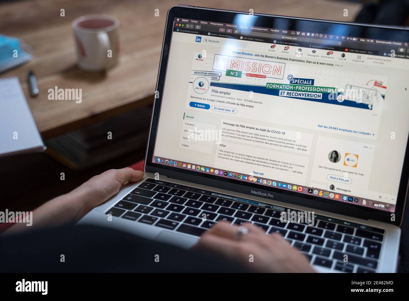 Someone looking at her open laptop computer Stock Photo - Alamy