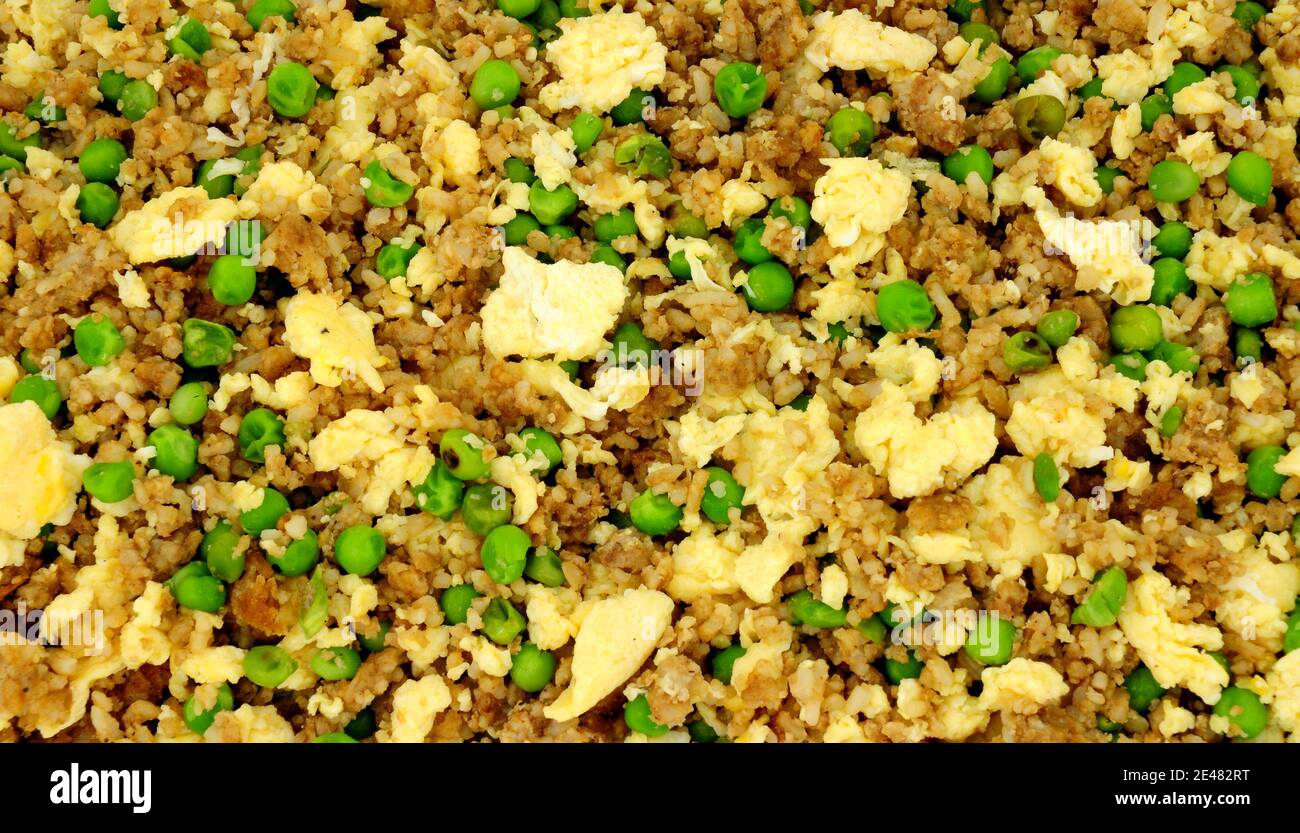 Chinese egg fried rice with peas background Stock Photo - Alamy