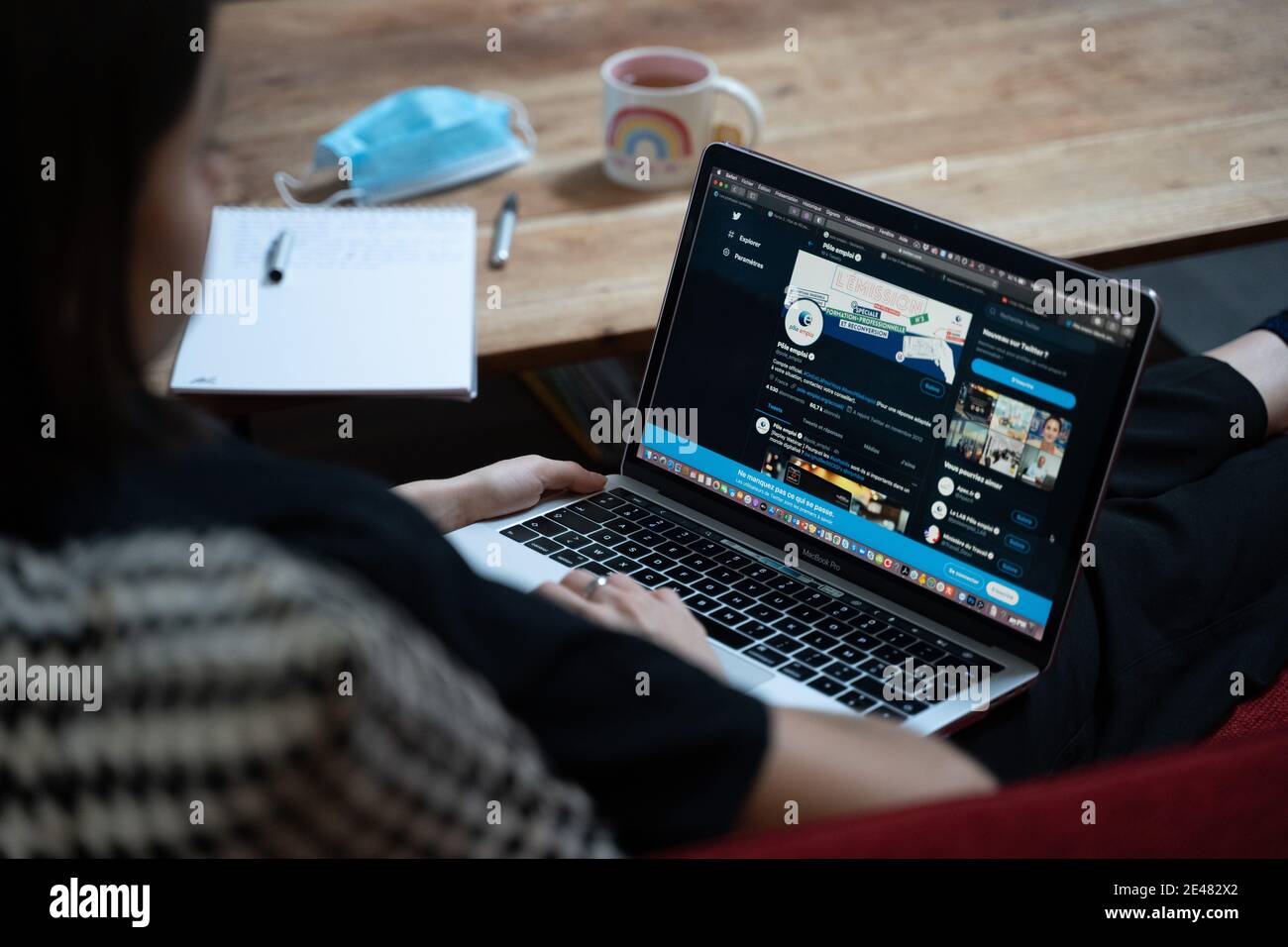 Someone looking at her open laptop computer Stock Photo - Alamy