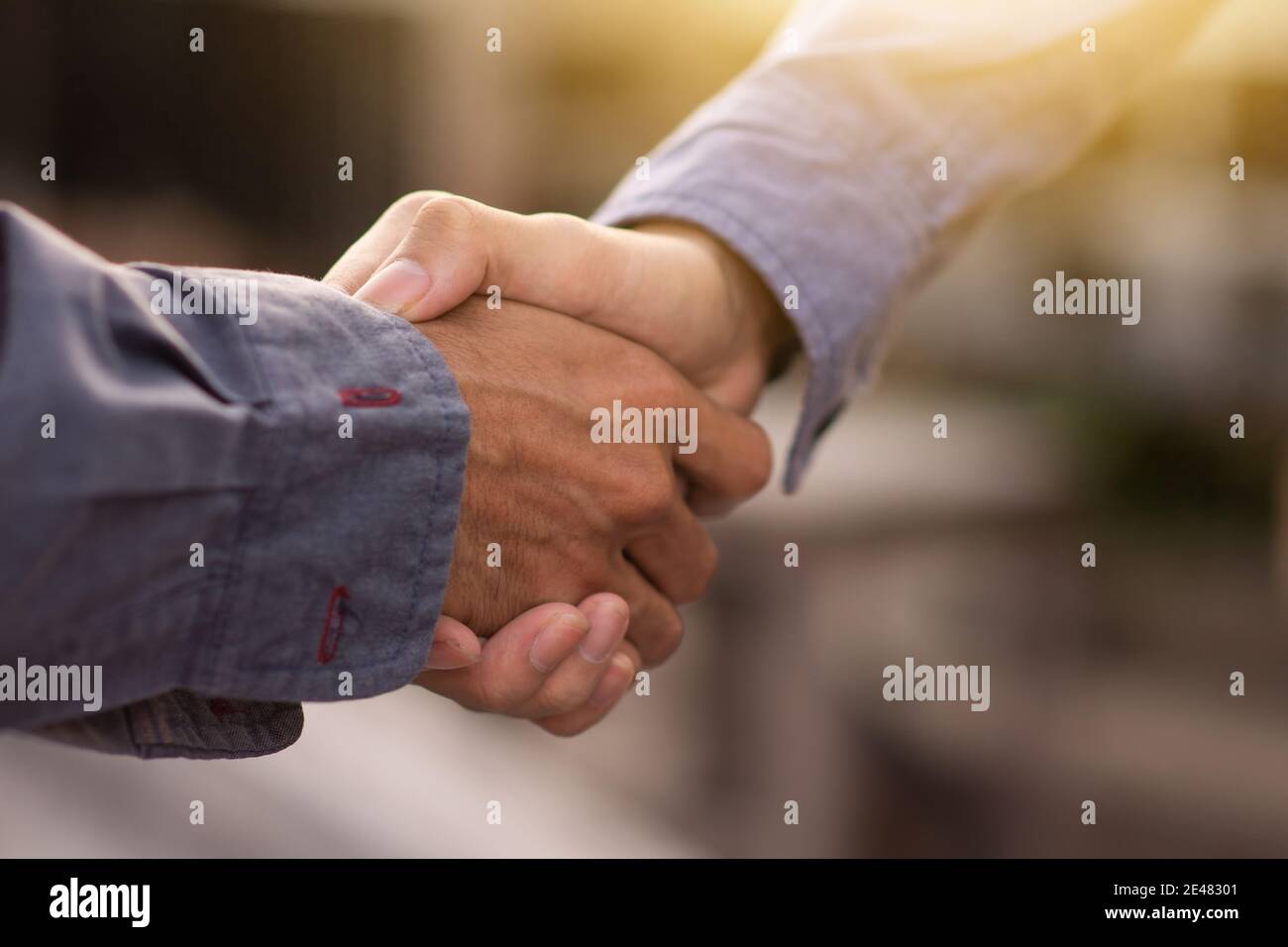Close up shake hand teamwork engineer on site construction background ...