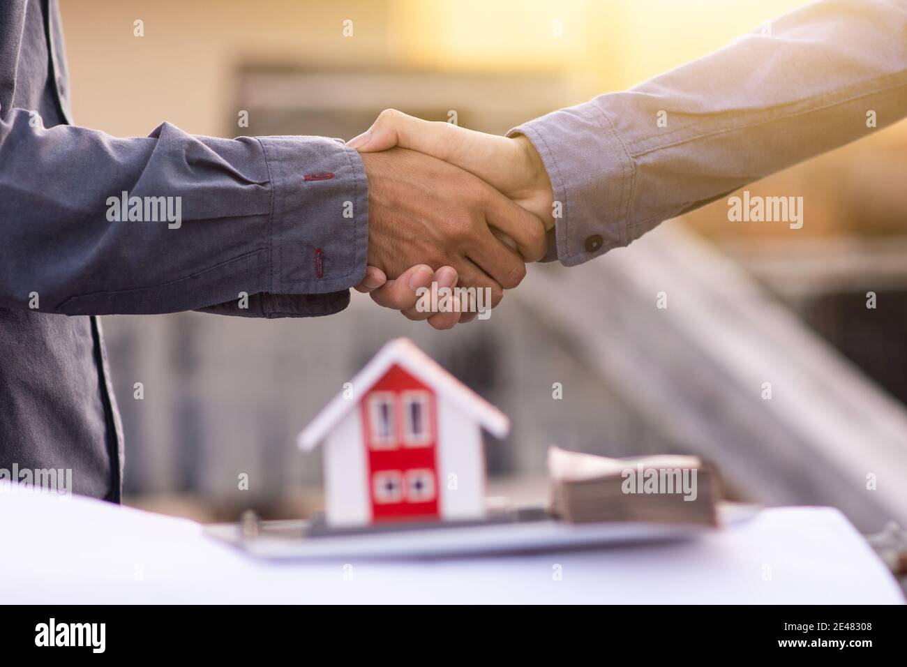 Close up shake hand teamwork engineer on site construction background ...