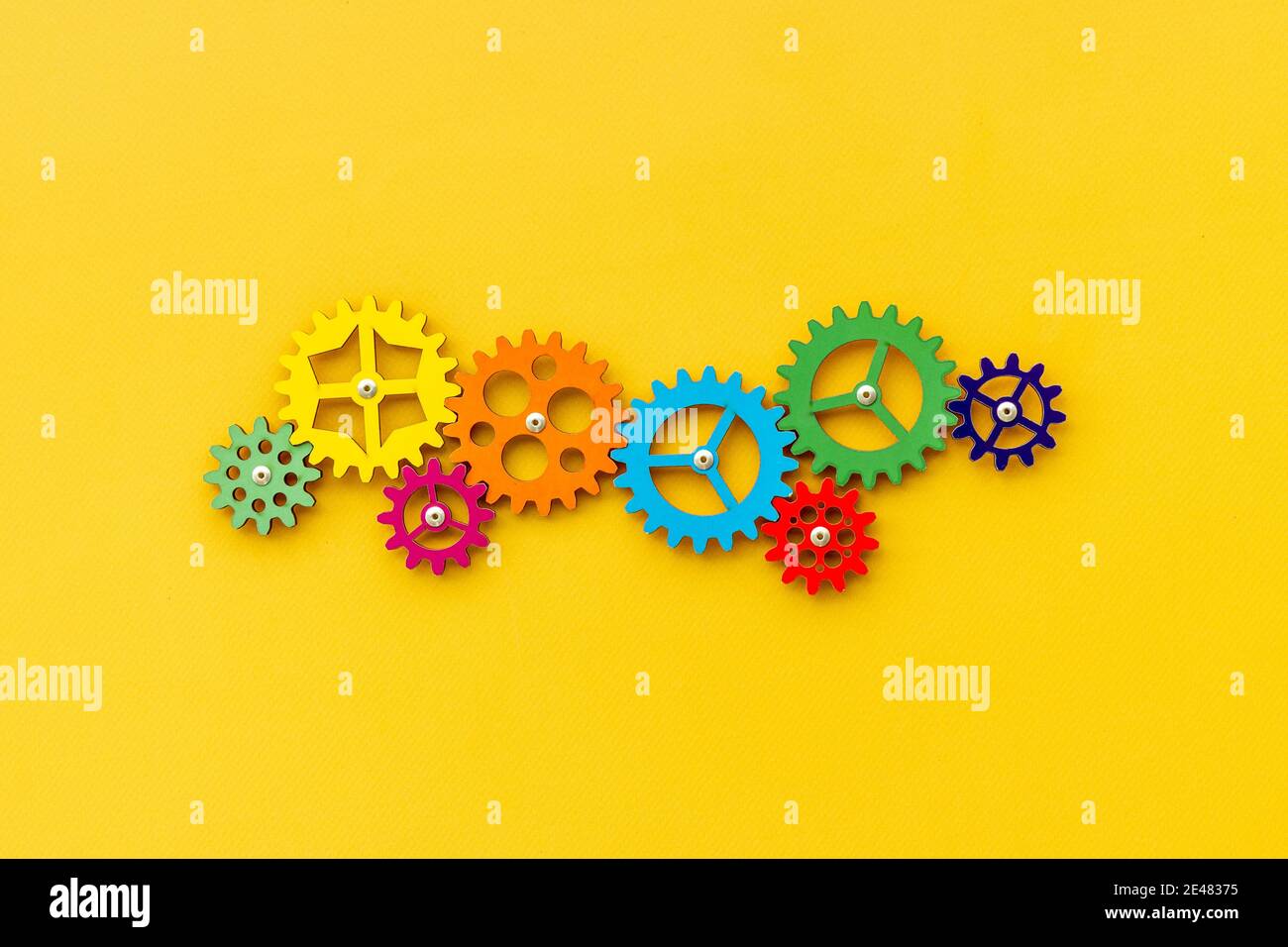 Top view of colorful gears. Corporate work and modern business process ...
