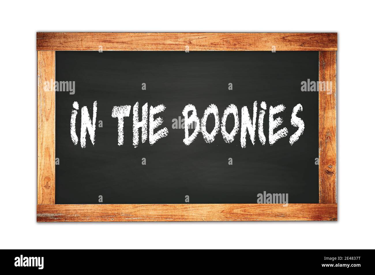 IN THE BOONIES text written on black wooden frame school blackboard ...