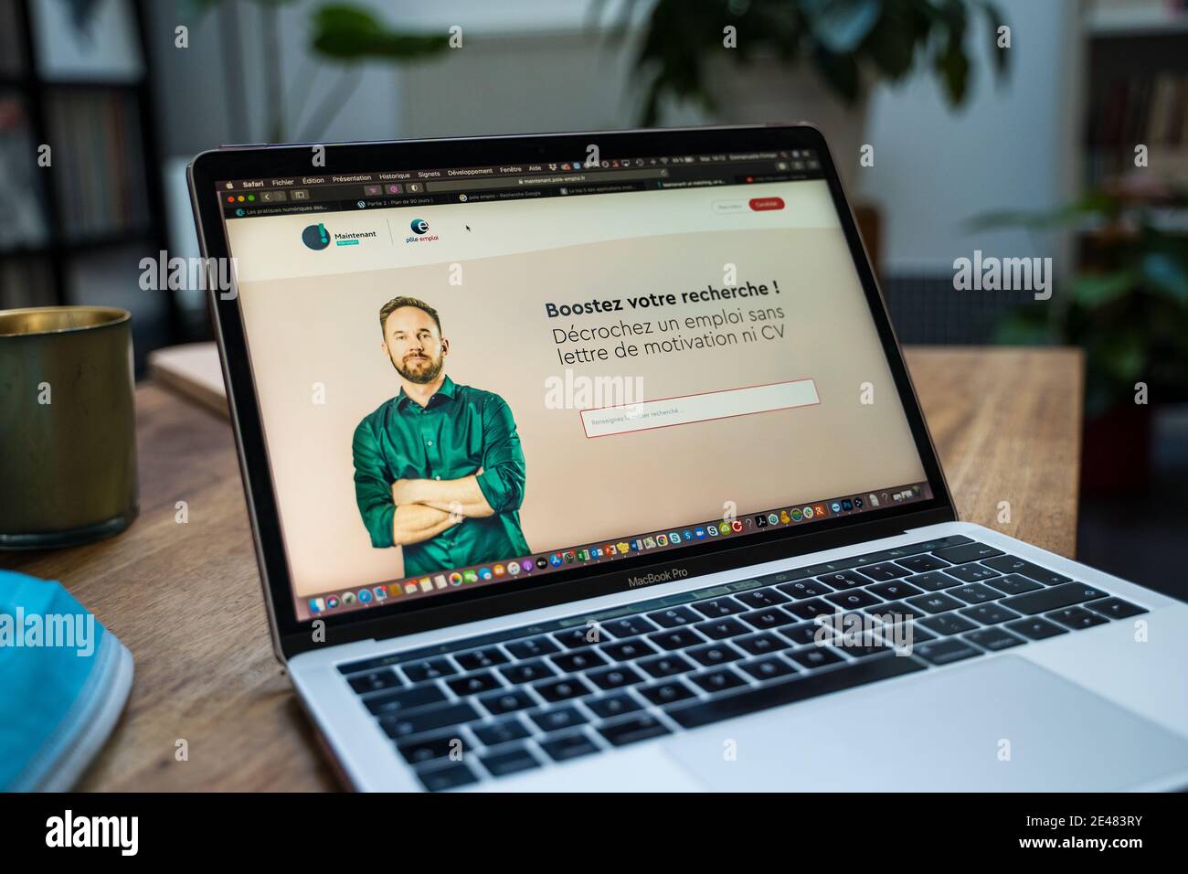 An open laptop computer sitting on top of a table Stock Photo - Alamy