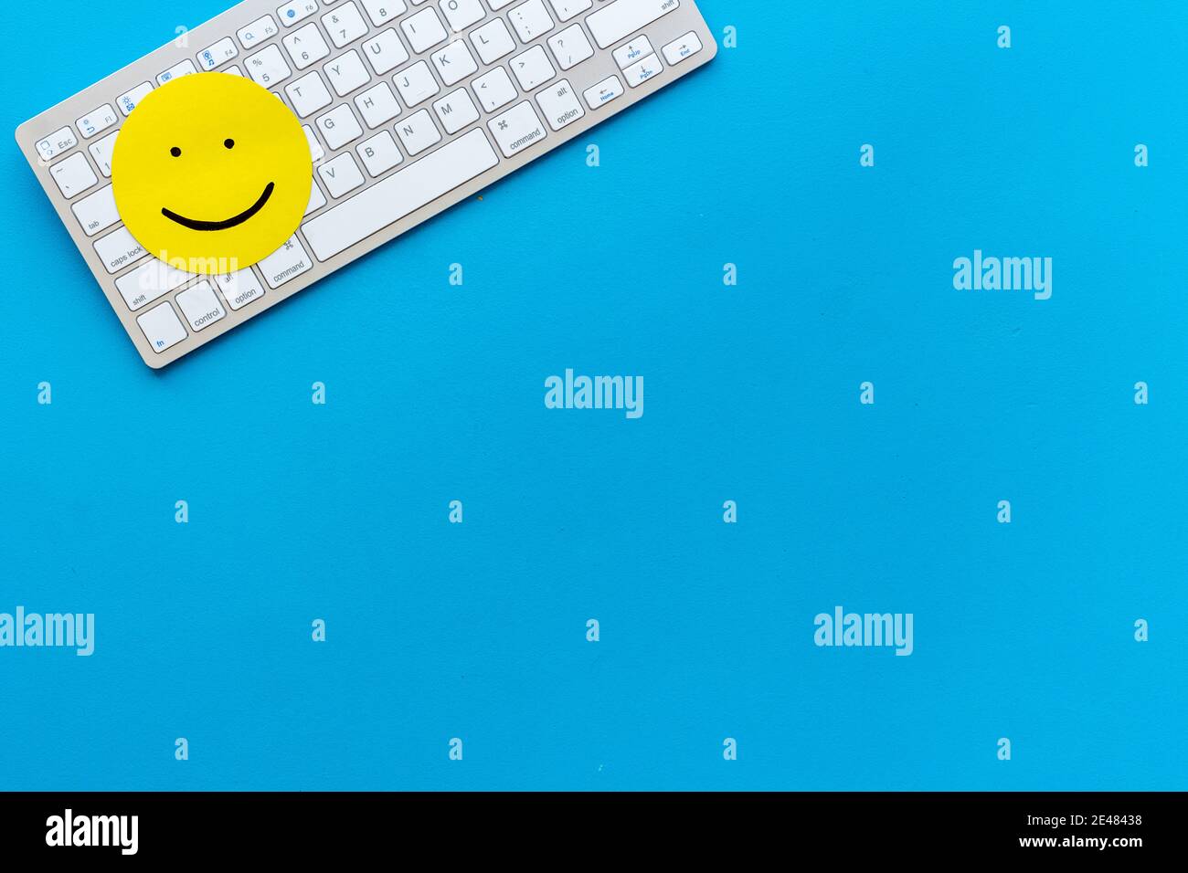 Smiling face emotion concept. Smile face on the keyboard, top view ...