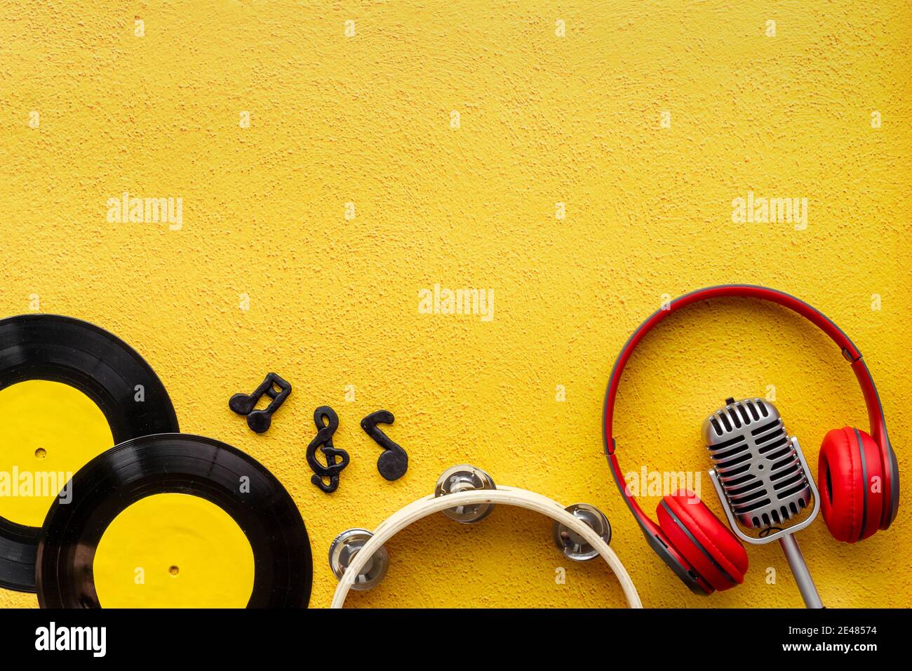 Flat lay musician concept - instrument with vinyl records, top view ...