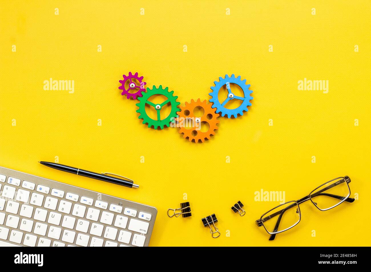 Business process and teamwork concept - working gears on office table, top view Stock Photo - Alamy