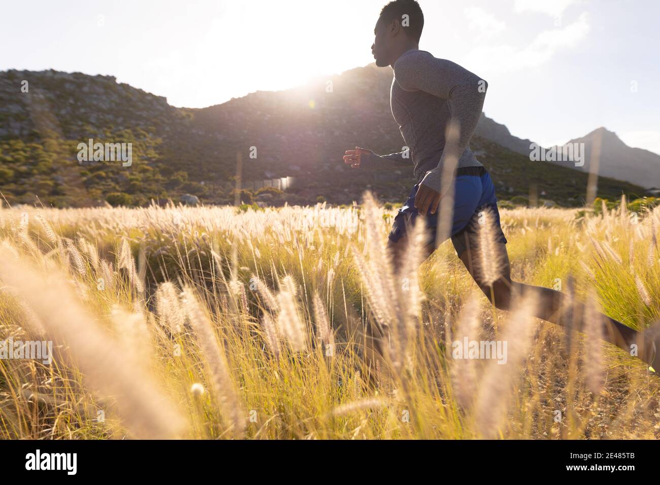 Man running grass hi-res stock photography and images - Alamy