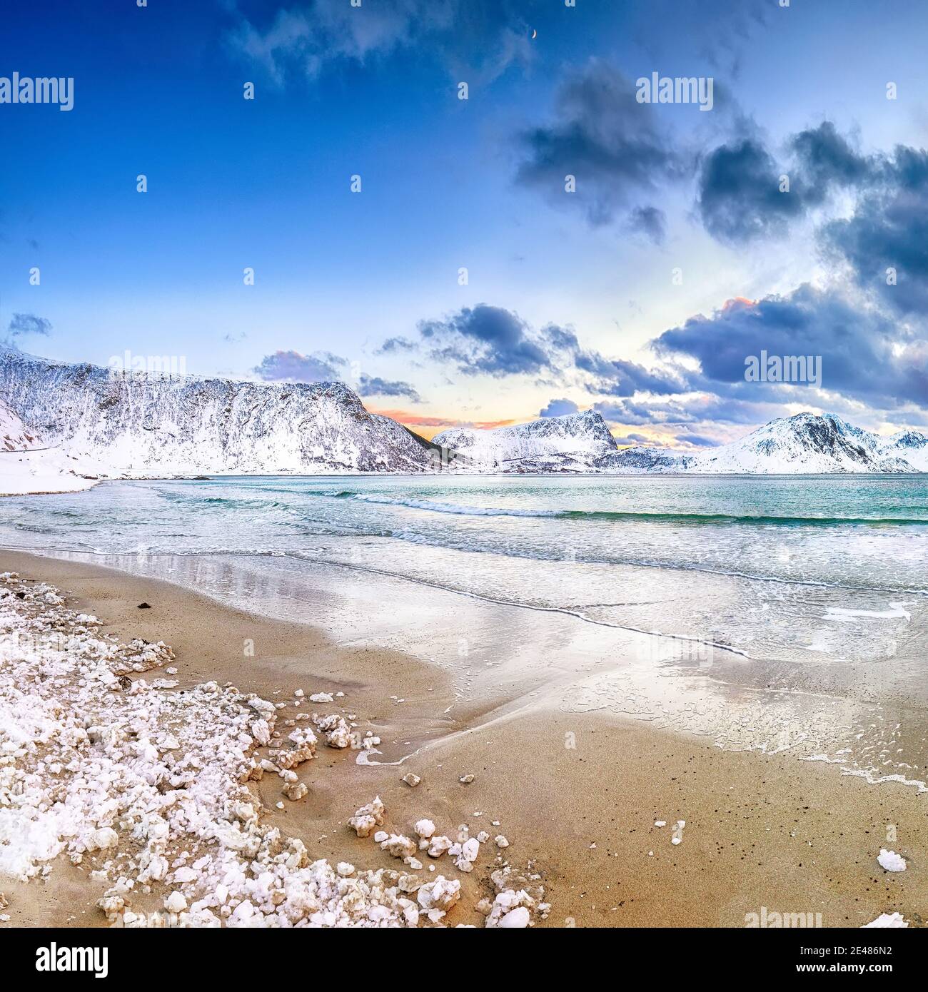 Splendid winter scenery with Haukland beach during sunset and snowy ...