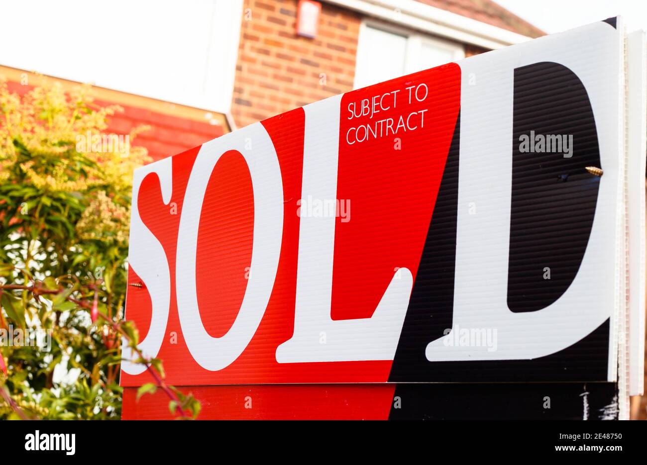 Sold Subject to Contract board outside house in UK Stock Photo - Alamy
