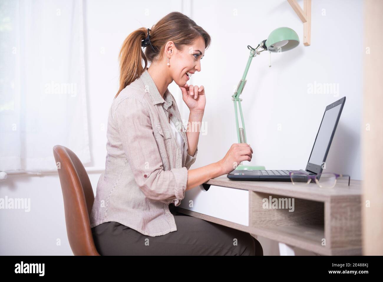 Female freelancer working remotely from hi-res stock photography and ...