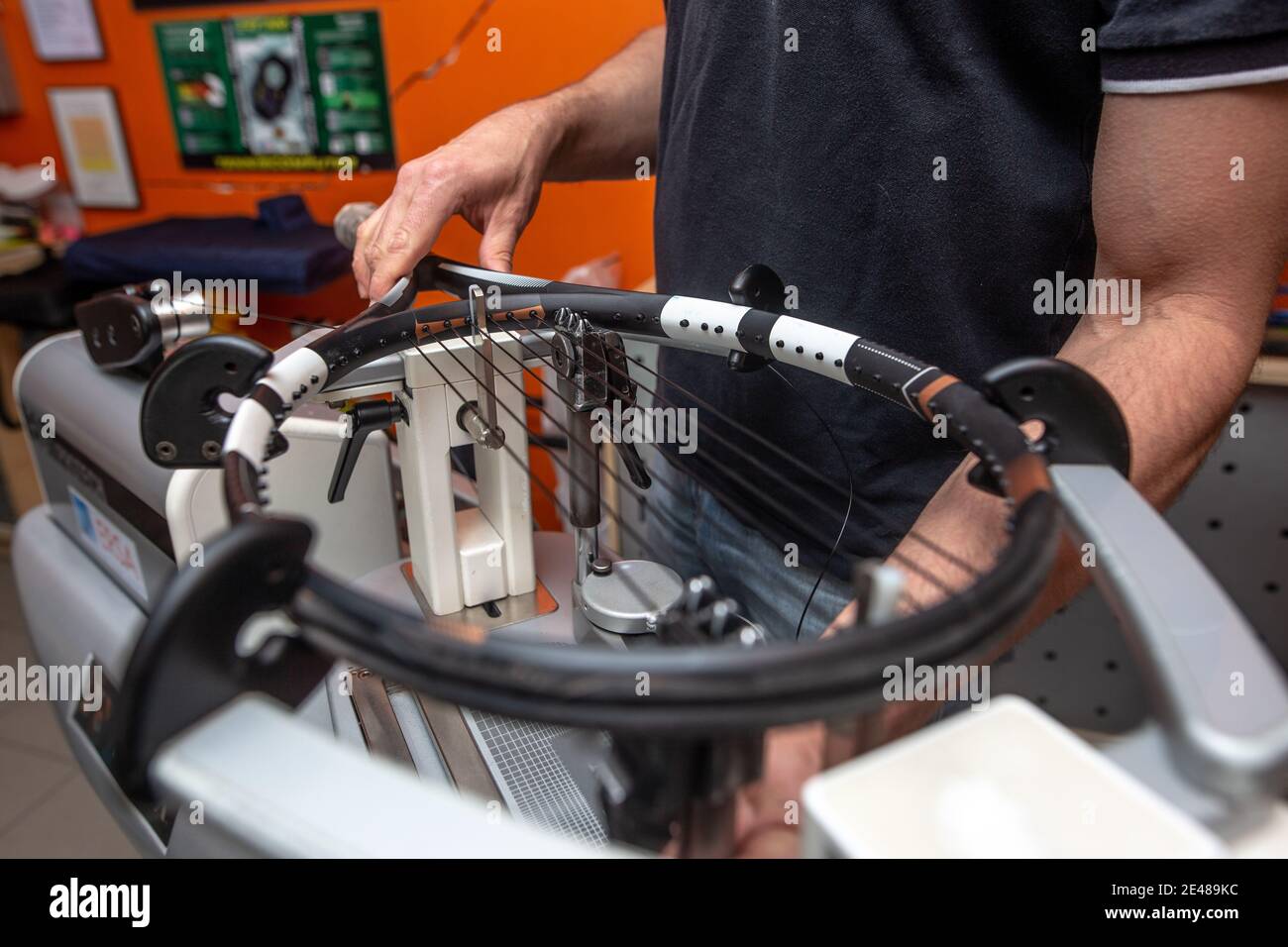 Stringing process of a new tennis racket, rocket string, sport concept ...