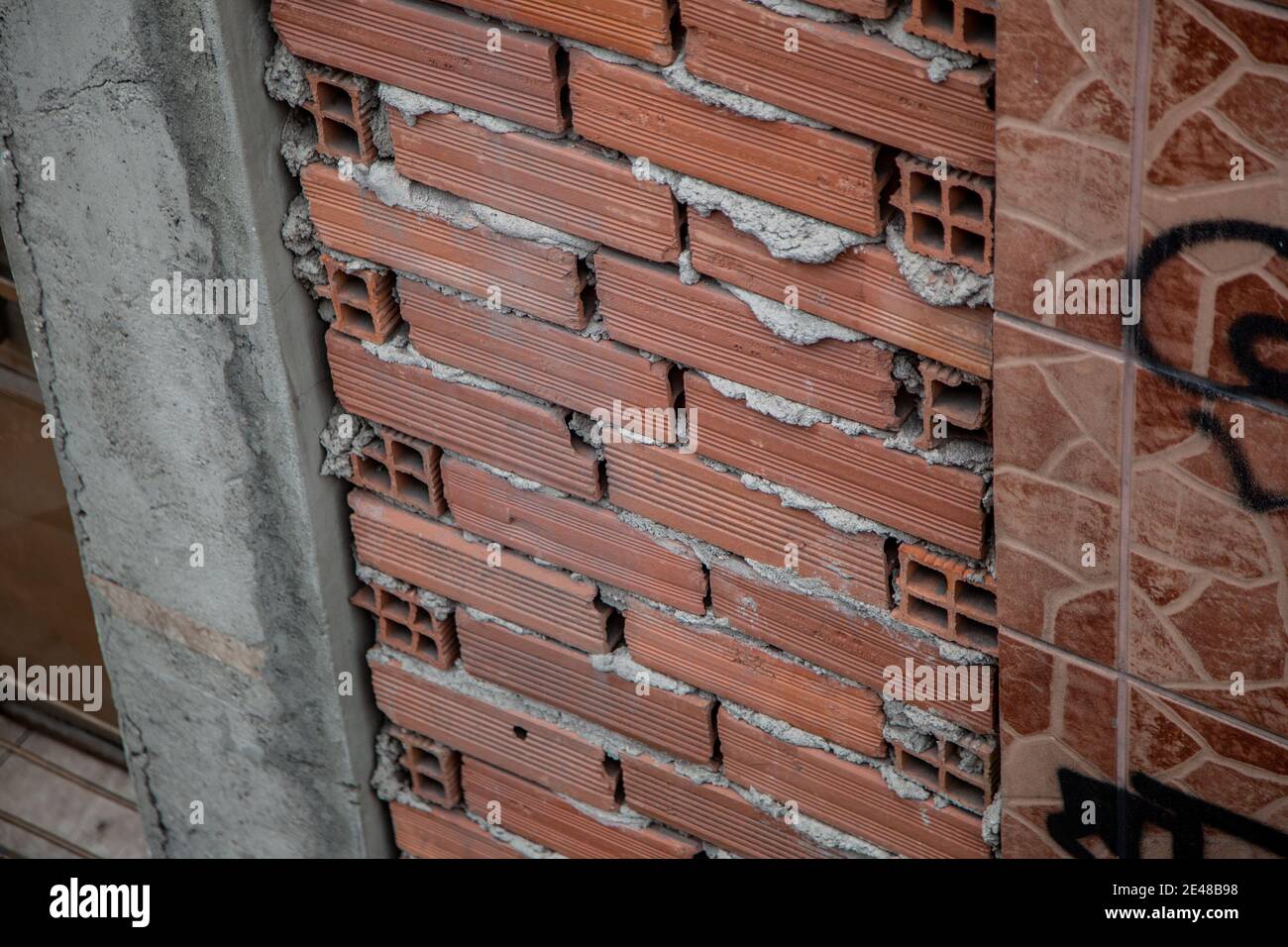 Brick wall with square holes Stock Photo - Alamy