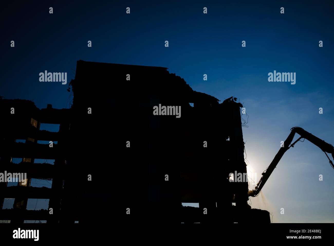 Silhouette of demolition of a buidlign Stock Photo - Alamy