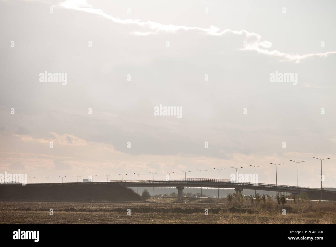 Rural landscape with a newly built freeway motorway road with traffic ...