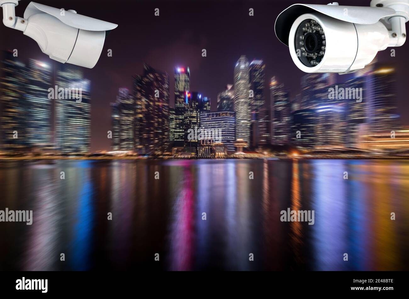 CCTV or surveillance camera on the colorful night city background Stock ...