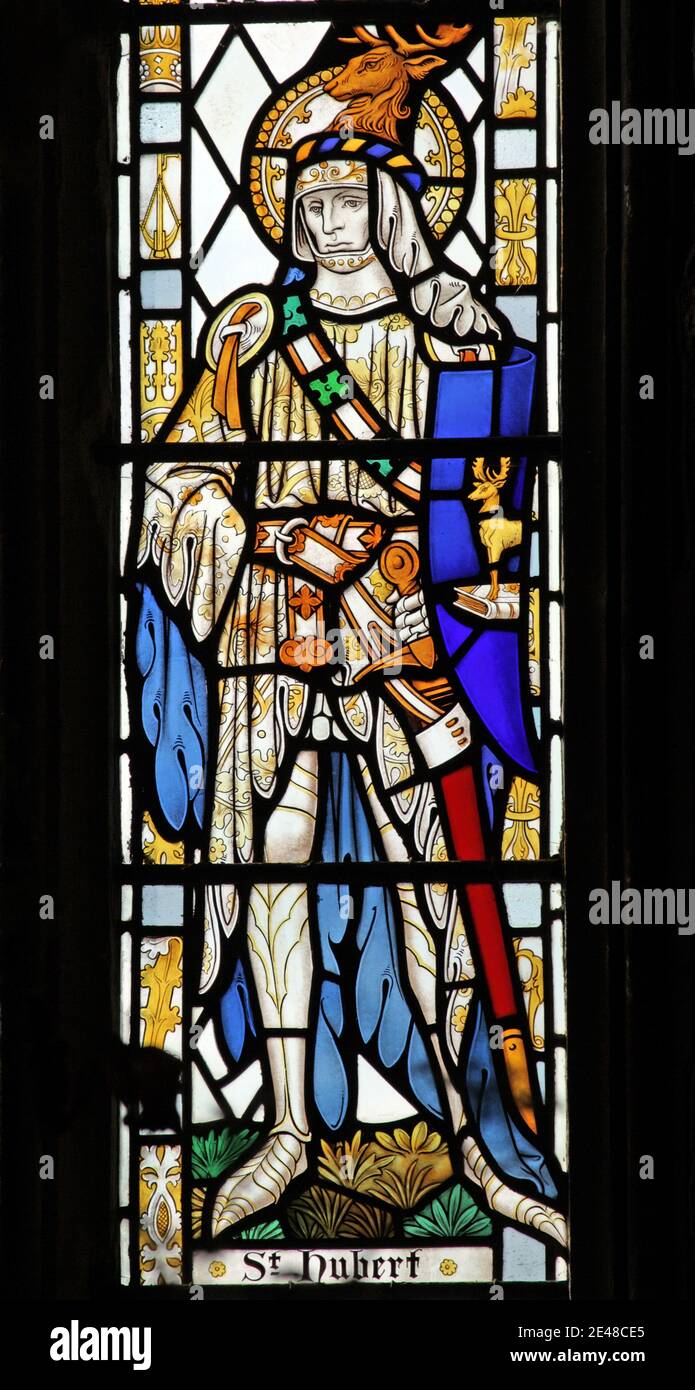 A stained glass window depicting Saint Hubert as an armoured knight ...