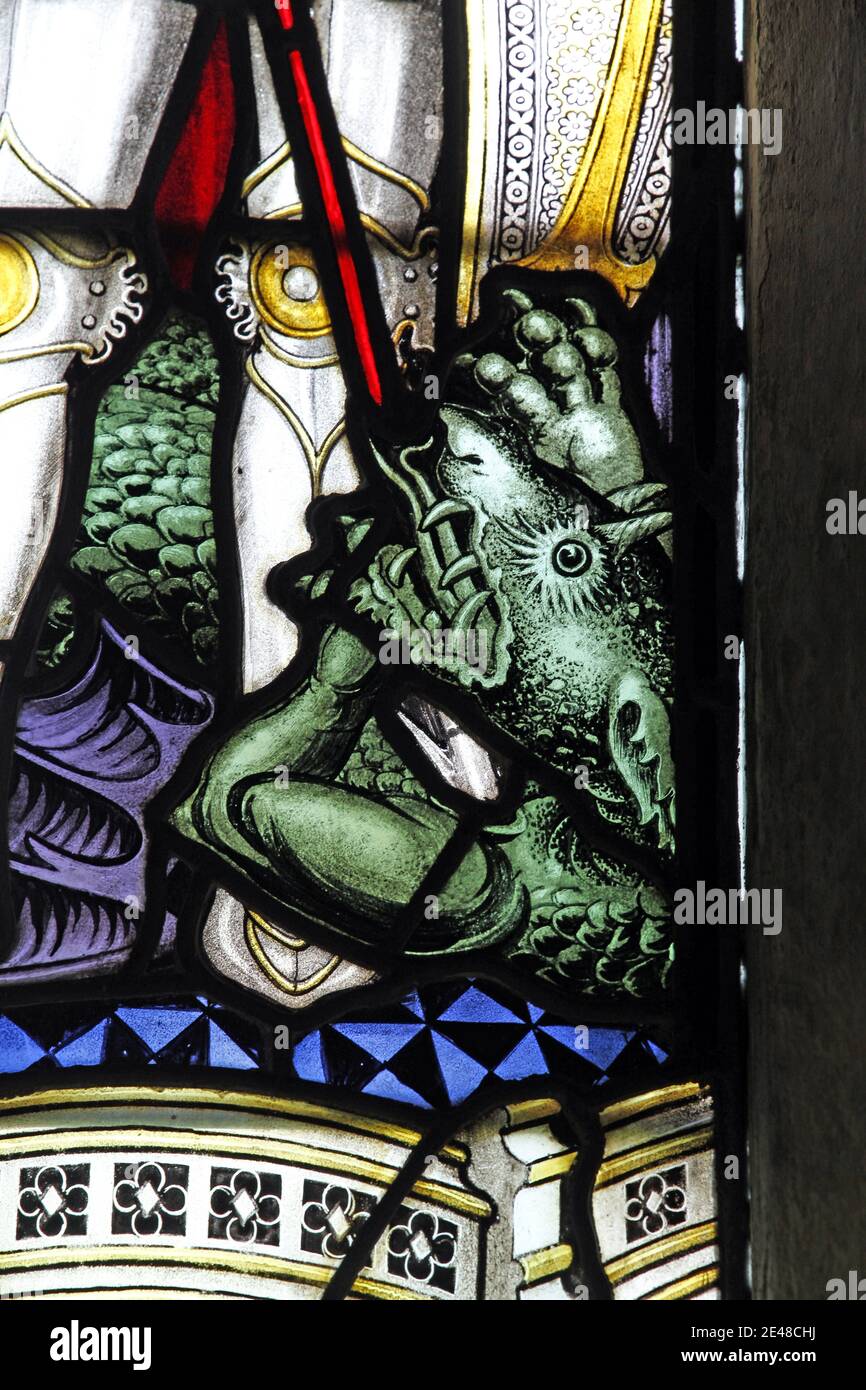 A stained glass window by the Kempe Studios of 1924 depicting satan ...