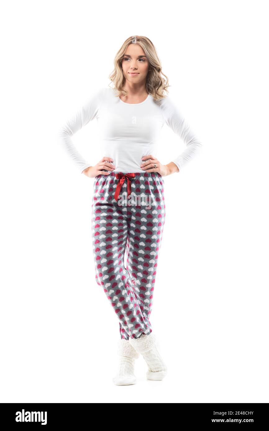 Unconvinced suspicious young beauty woman in pajama looking away with ...