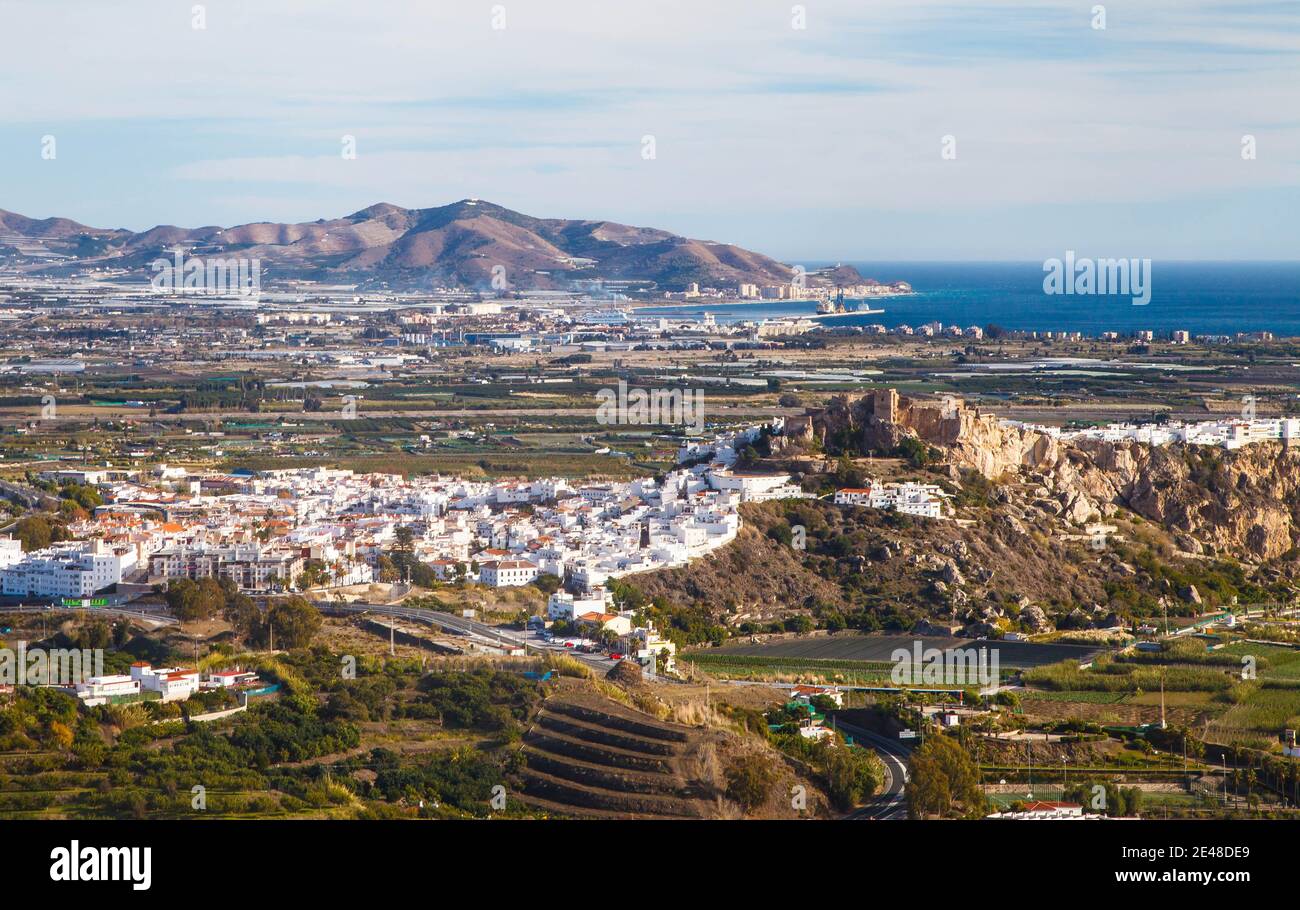 View of Salobrena town and castle with coast behind and port of Motril ...