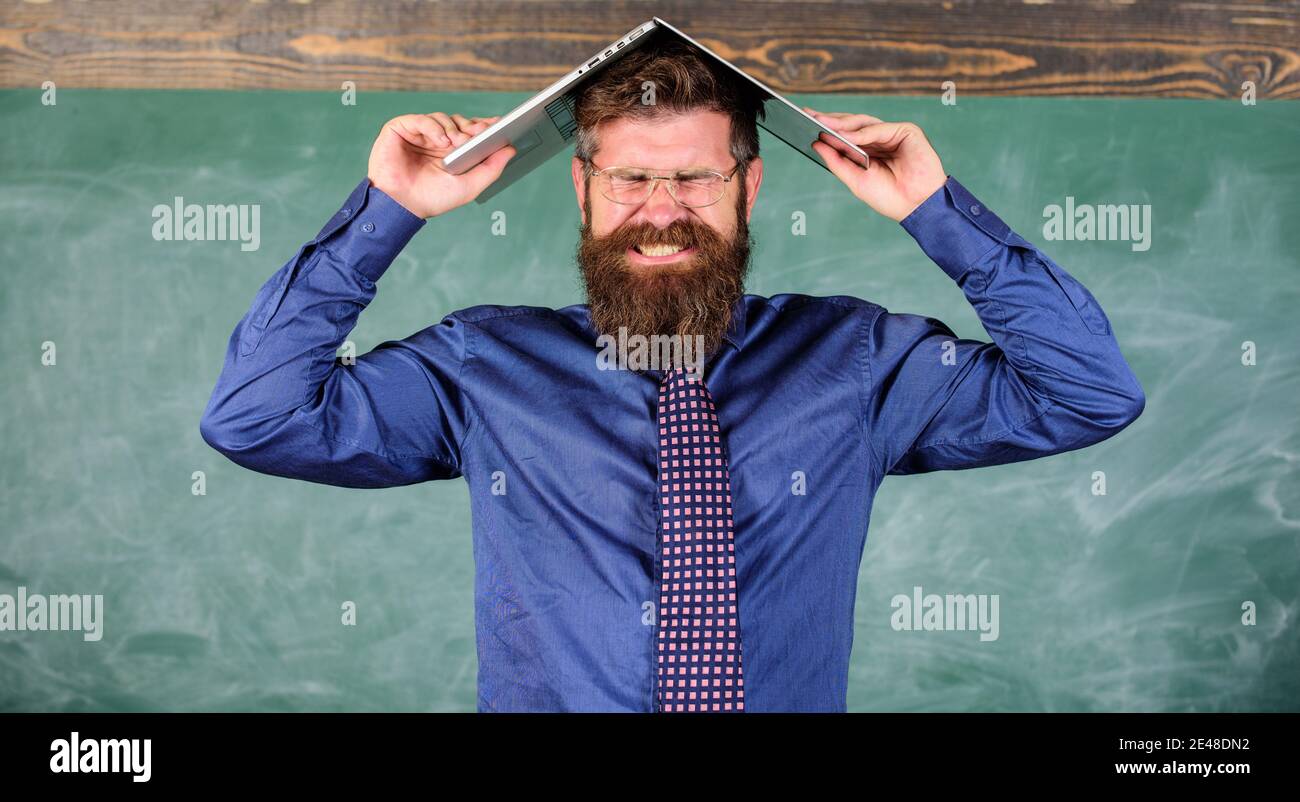 Hipster teacher aggressive with laptop as roof goes mad about teaching ...