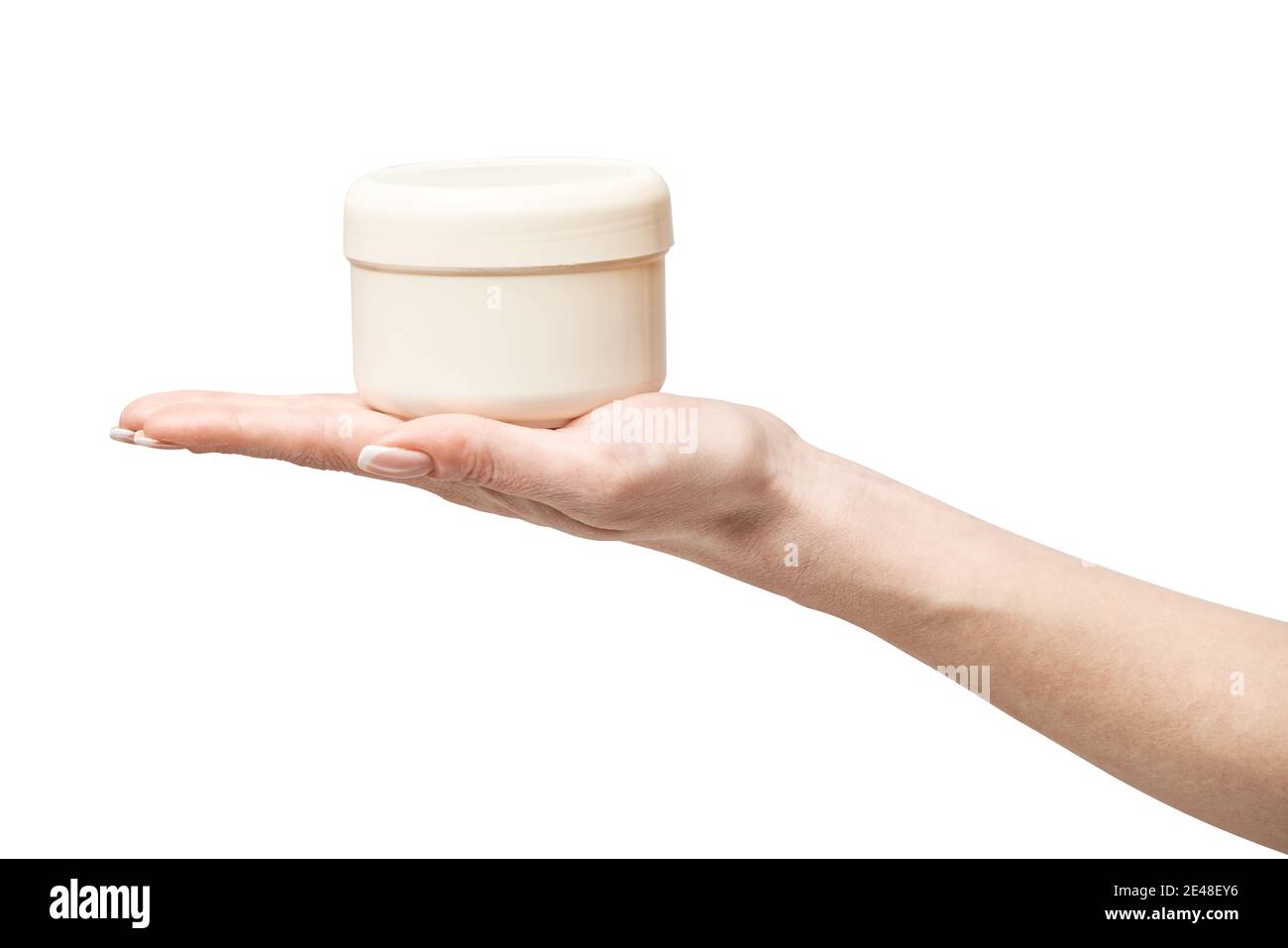 hand holding plastic can of cream Isolated on a white background Stock ...