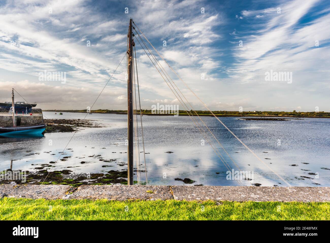 A peaceful summer evening on the quayside at Kinvara Bay, Kinvara ...