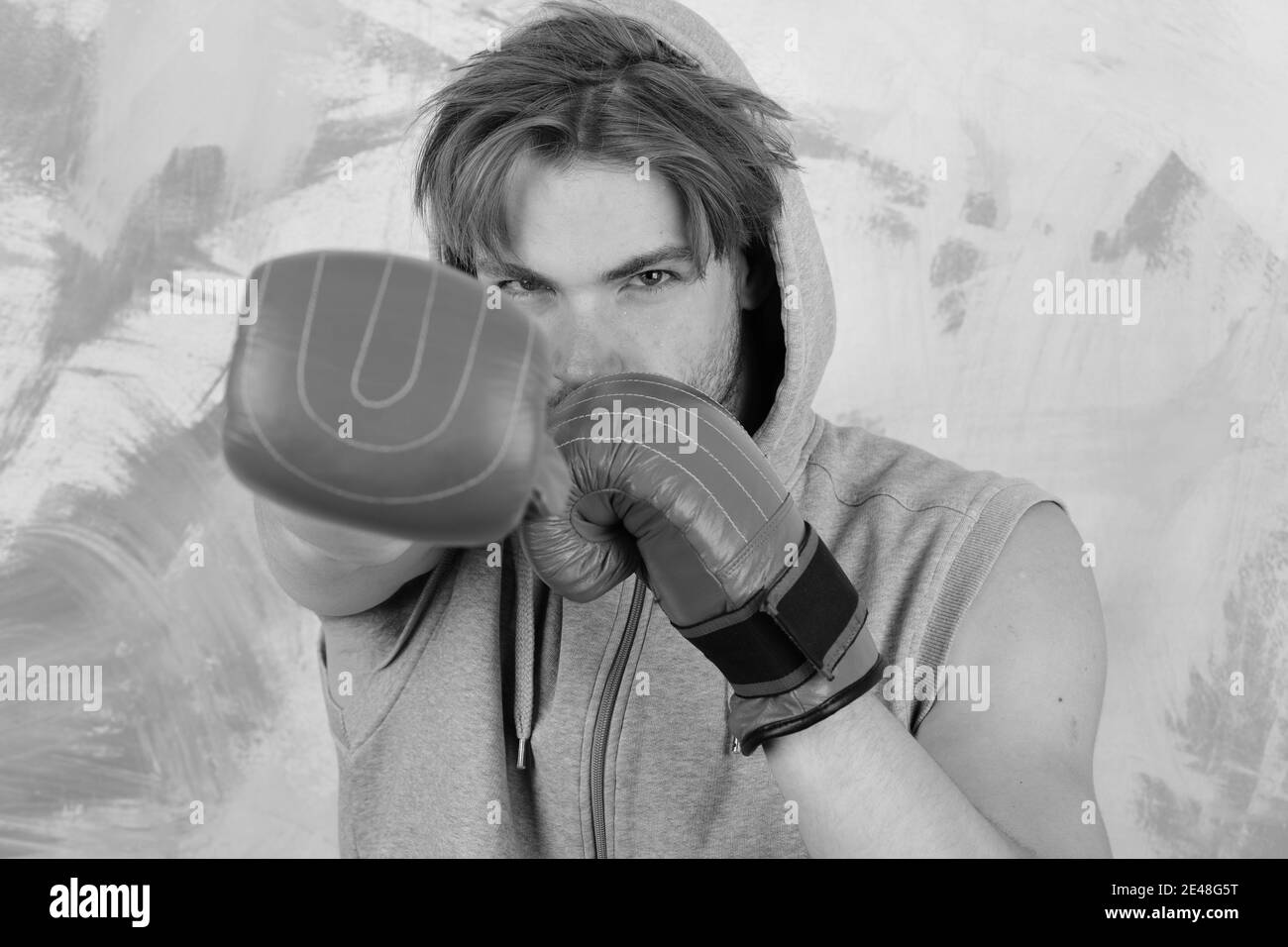 Man with messy hair on colorful background, selective focus. Boxer with ...