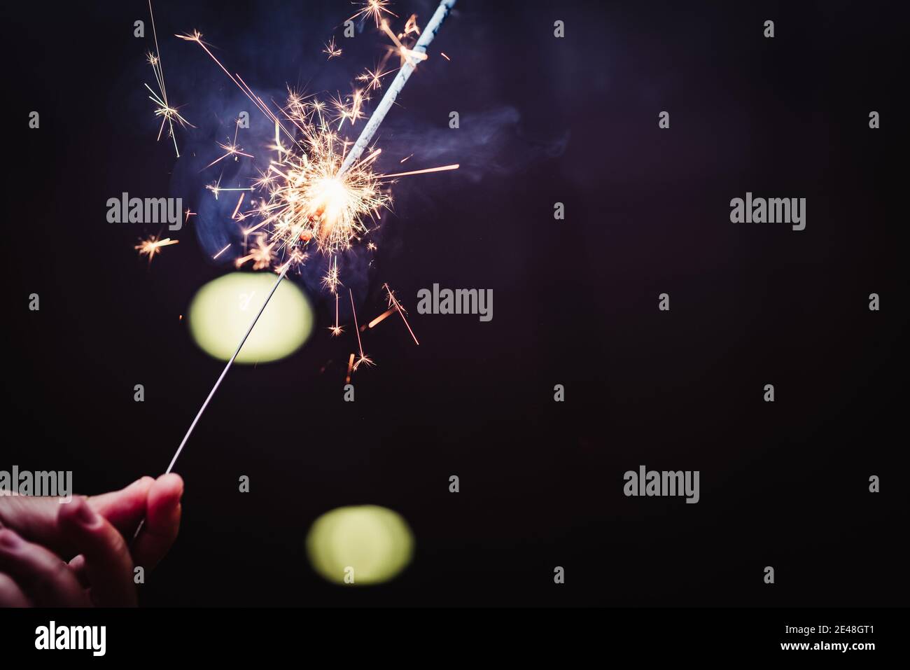 hand with sparkler and light Stock Photo - Alamy