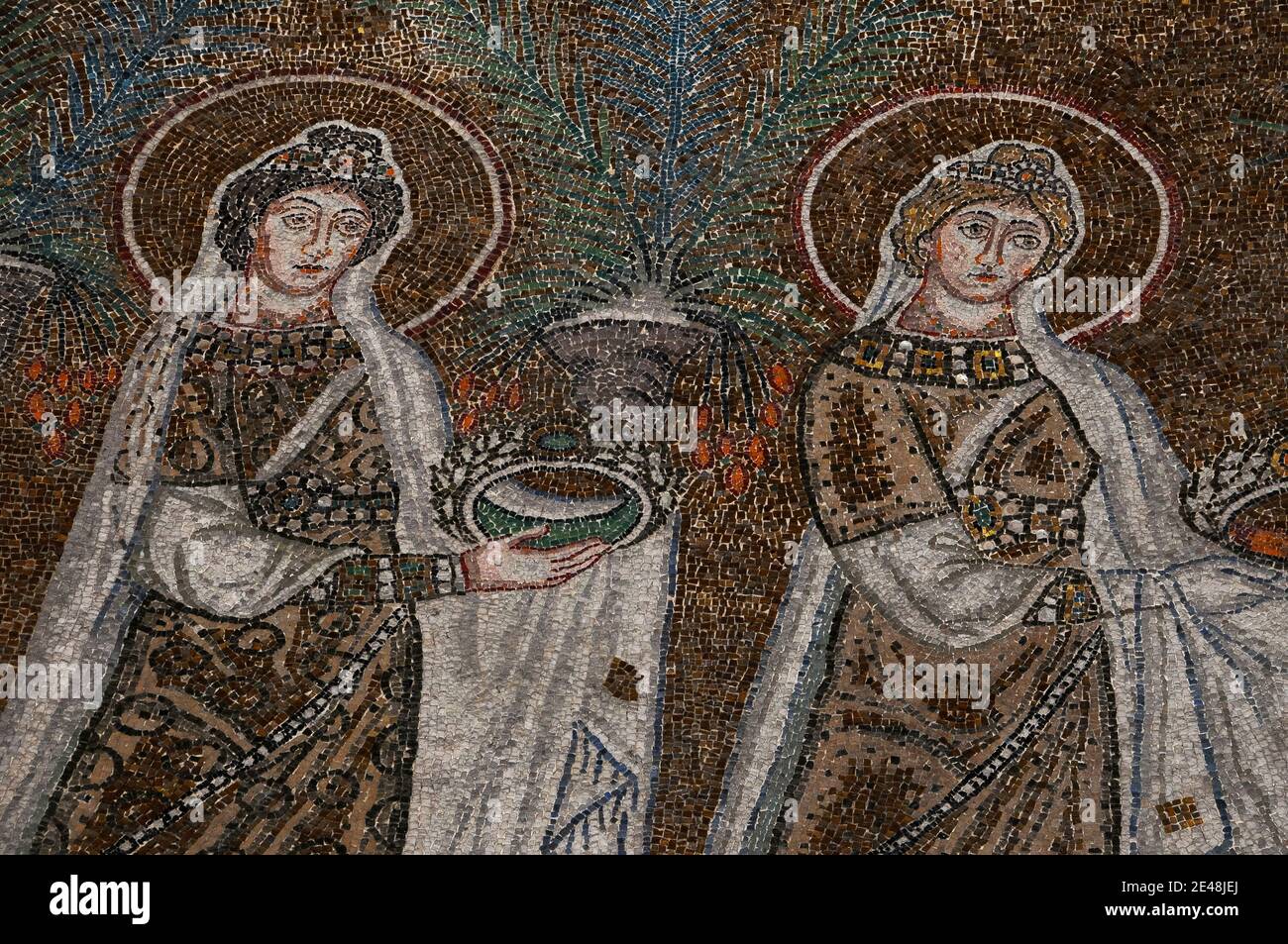 Bejewelled and sumptuously dressed female Christian Saints walk in ...