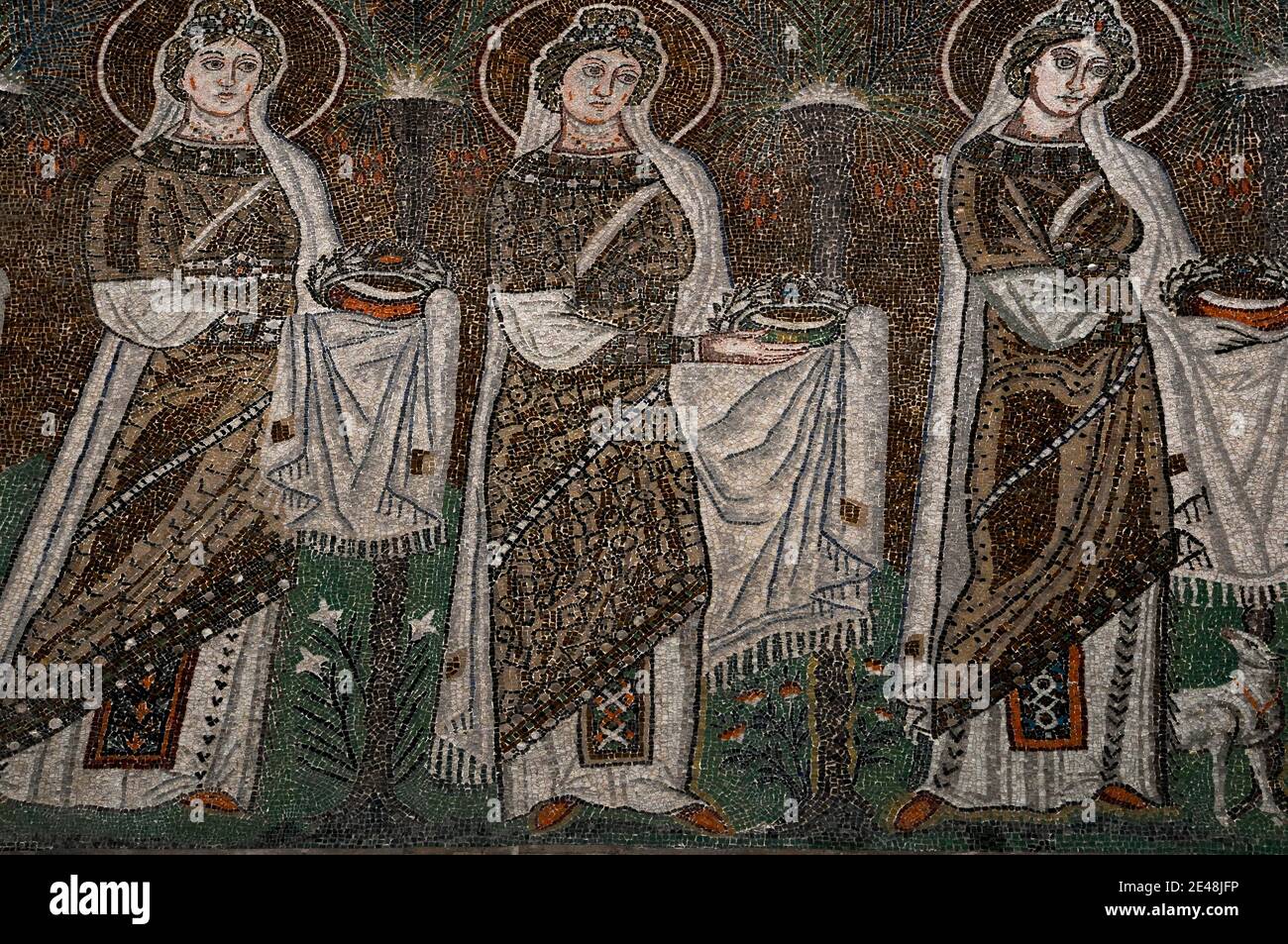 Bejewelled and sumptuously dressed female Christian Saints walk in ...