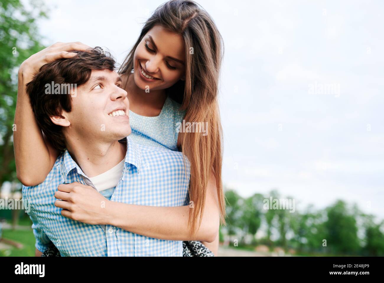 Young Happy Couple Embracing And Having Fun In The Summer In The City