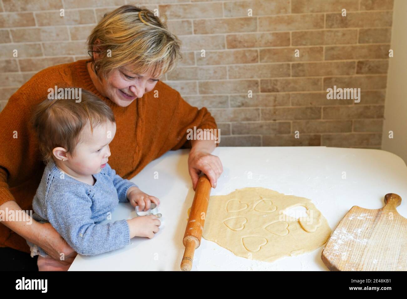 Old woman baking cookies hi-res stock photography and images - Alamy
