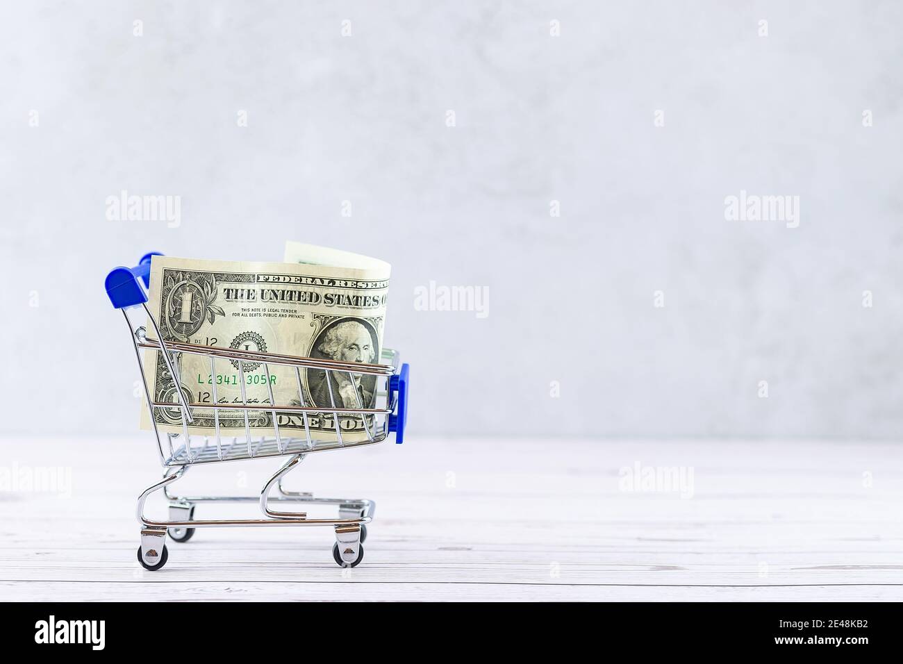 Financial concept, bank notes in the shopping cart. shopping cart with ...
