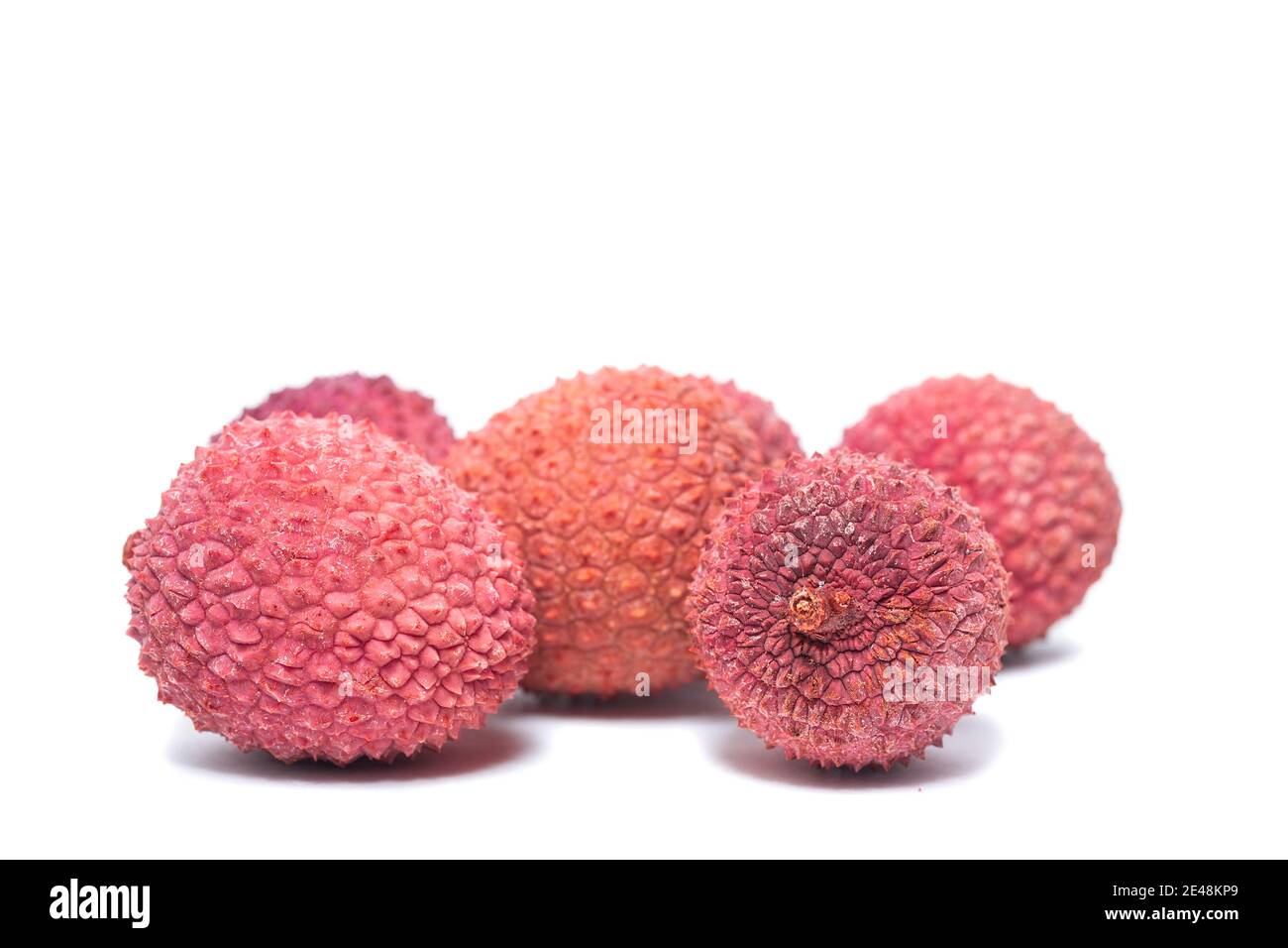 Pile of fresh ripe lychees on white background Stock Photo - Alamy
