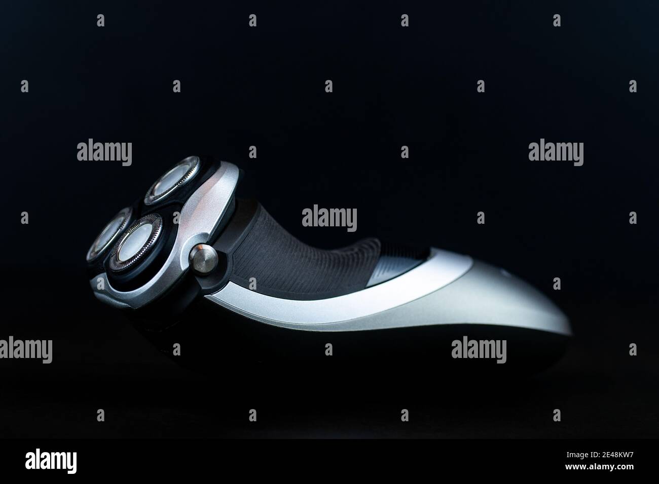 Electric razor close-up on black background Stock Photo - Alamy
