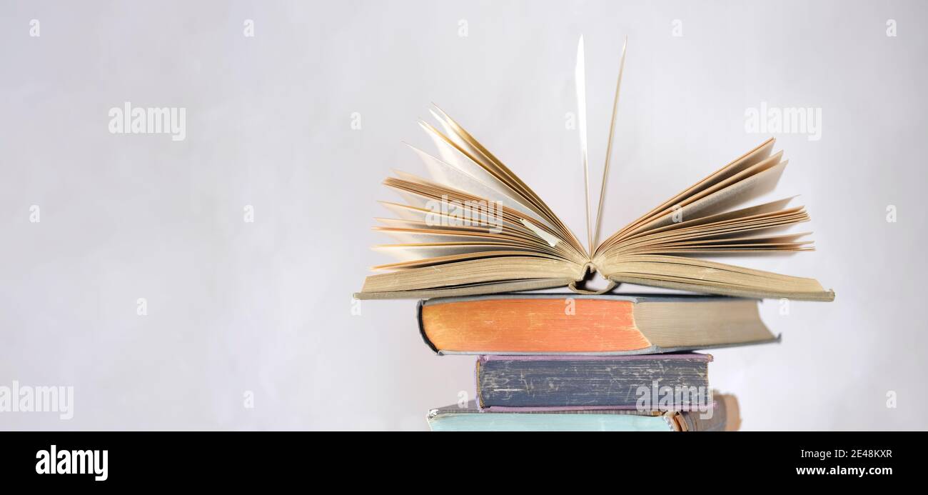 opened book and stack of book,reading,education,home office, back to ...