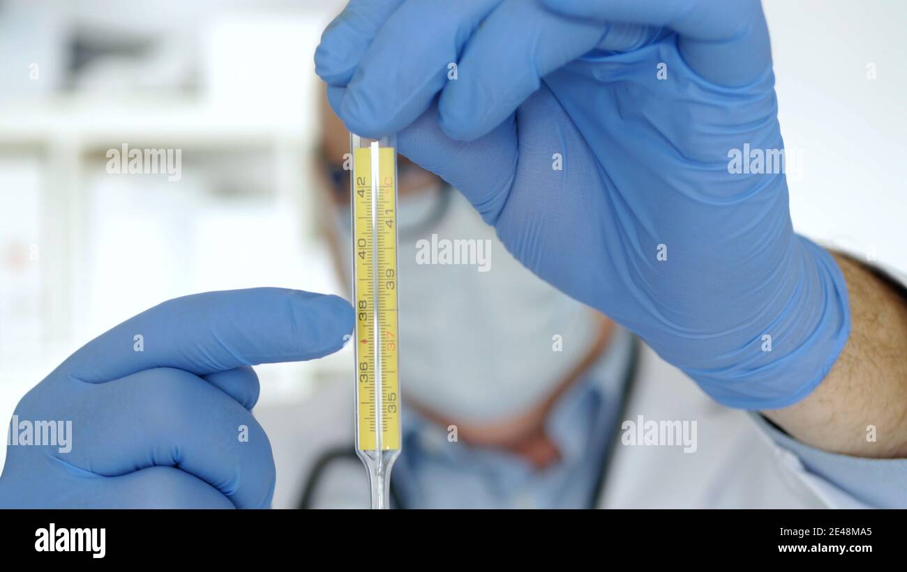 Doctor checking temperature hi-res stock photography and images - Alamy