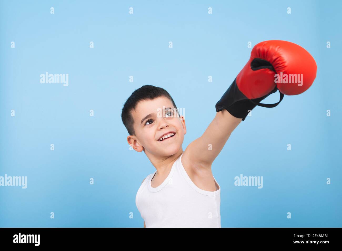 child throws punch with boxing gloves Stock Photo - Alamy