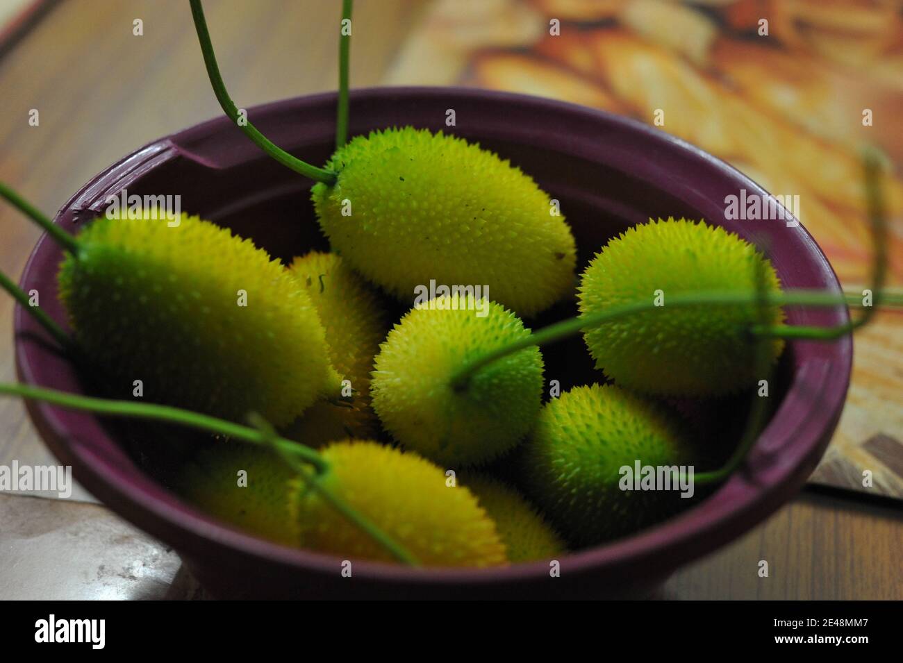 High angle closeup shot of a bowl full of the spiny gourd vegetable ...